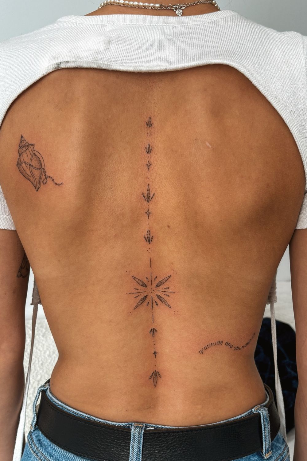 30 Stunning Small Back Tattoos That Will Inspire Your Next Ink