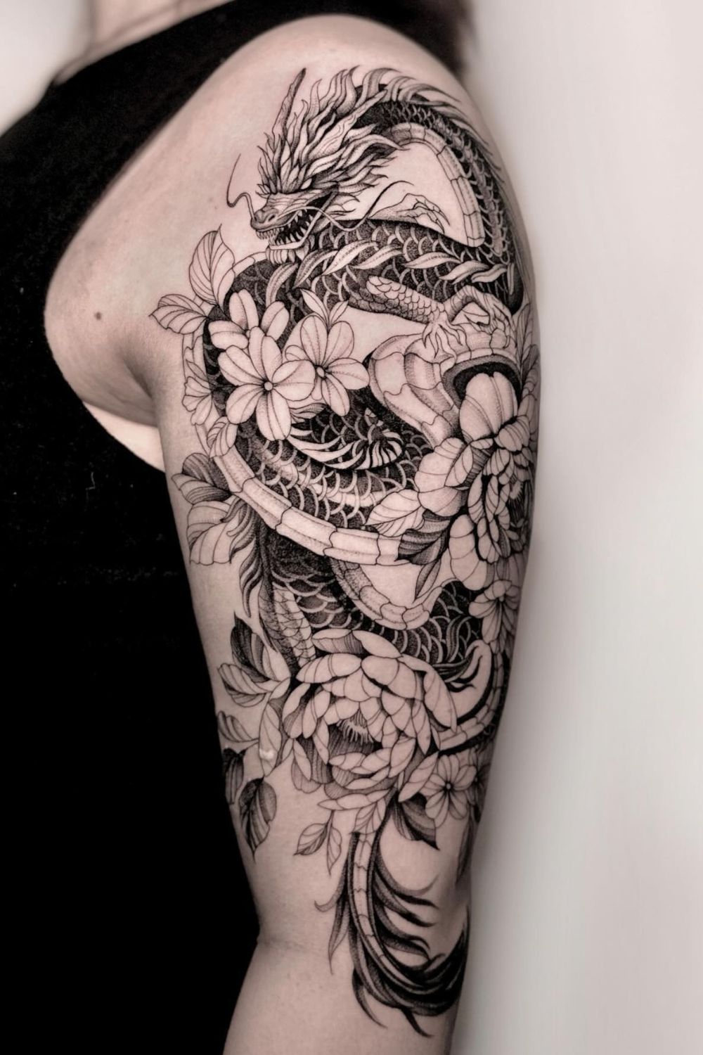 27 Empowering Dragon Tattoo With Flowers Ideas