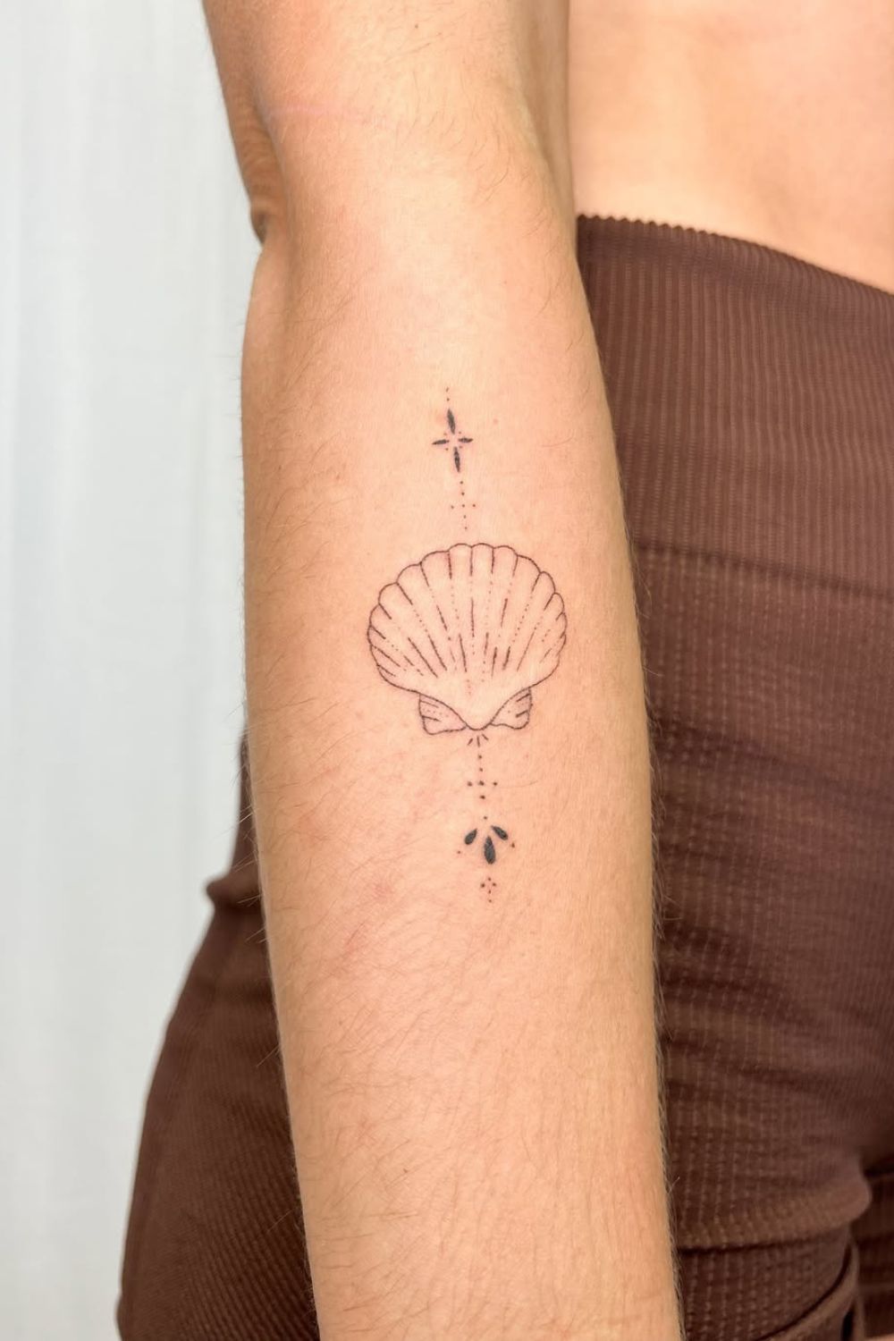 10 Fine Line Shell Tattoo Inspiration